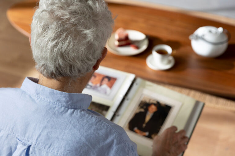 grandpa-looking-picture-albums - Anthem Senior Homes